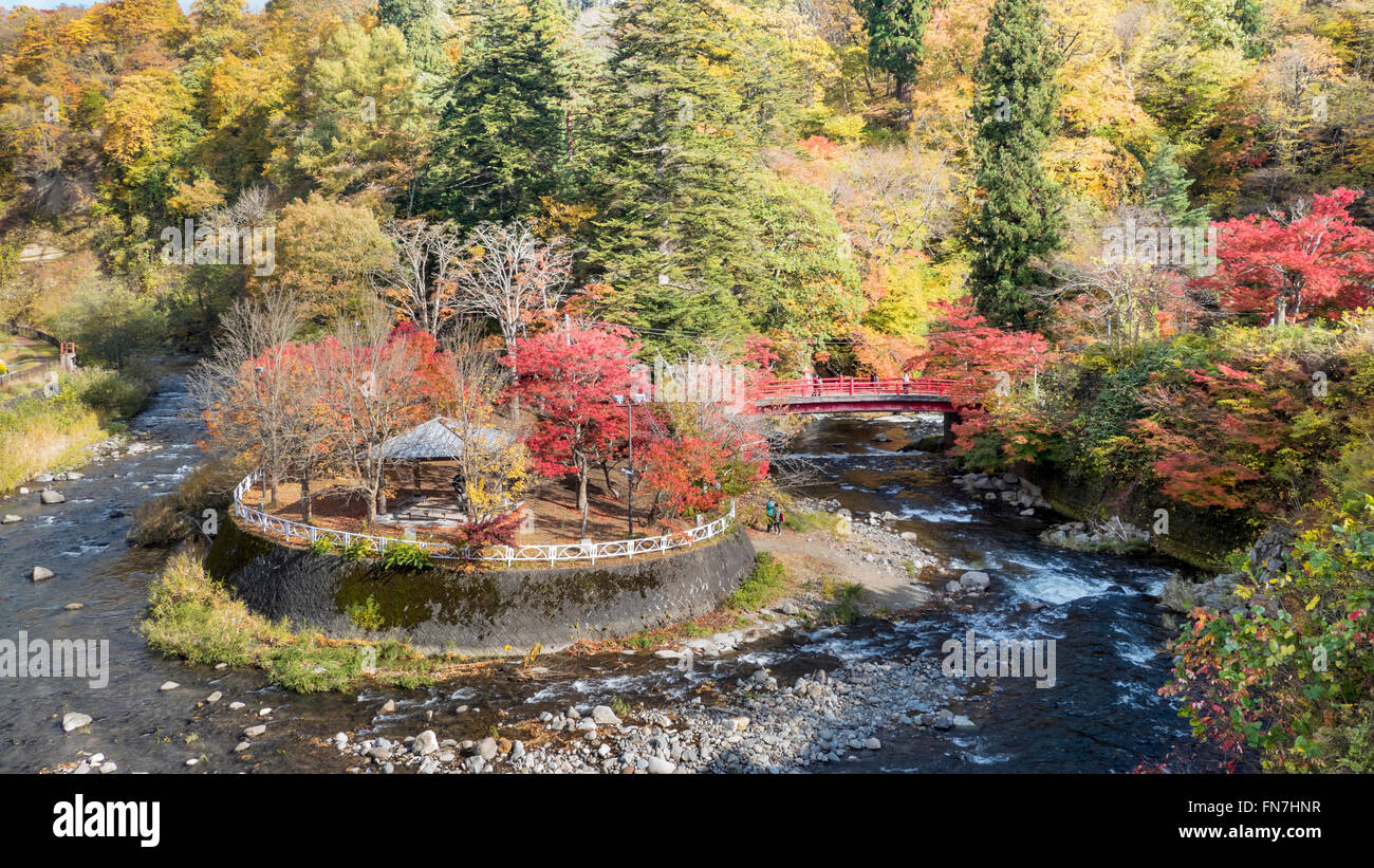 The Fudo stream and the red bridge at Mount Nakano-Momiji Stock Photo ...