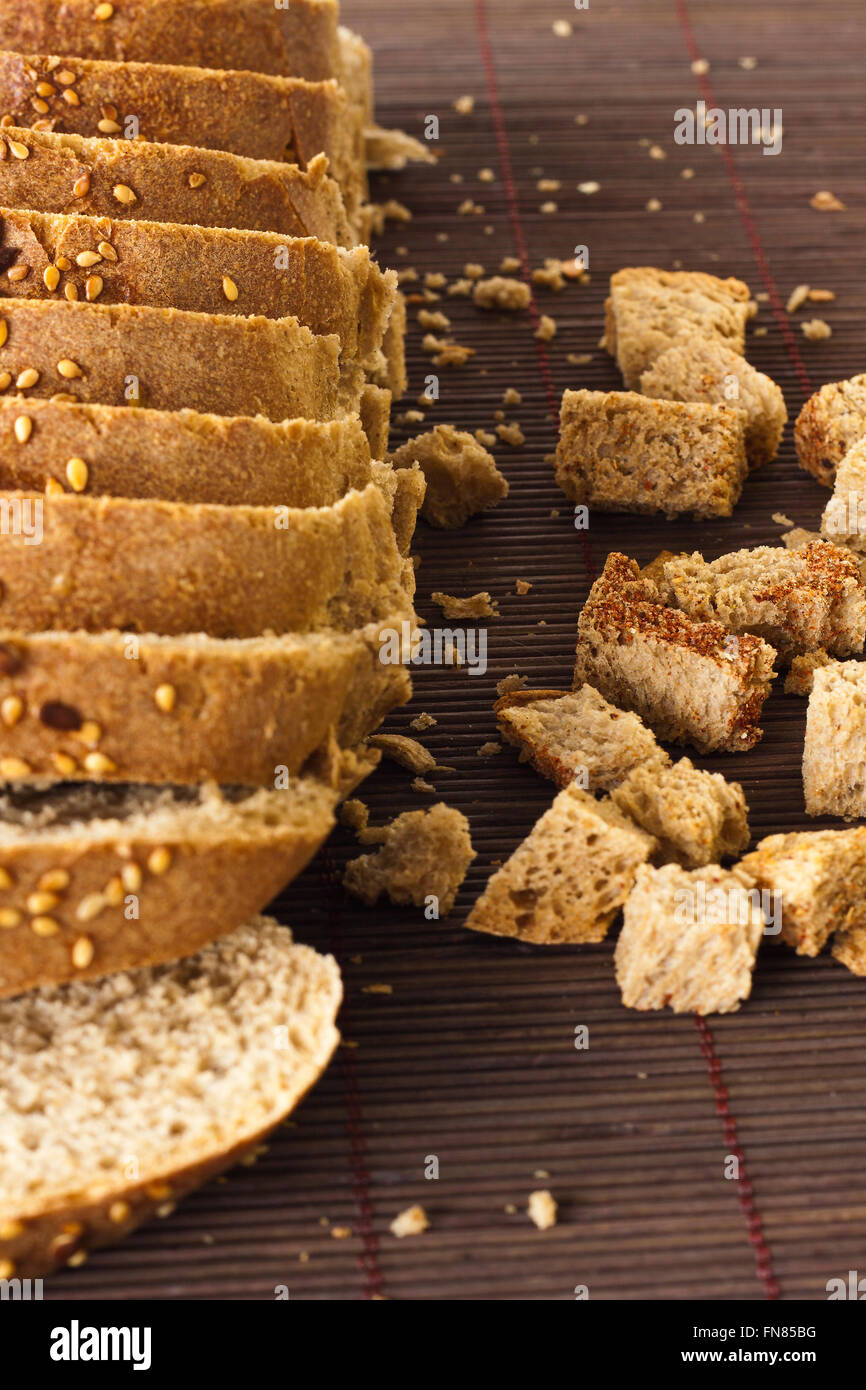 Black rye bread with sliced layer of seeds and nuts Stock Photo - Alamy