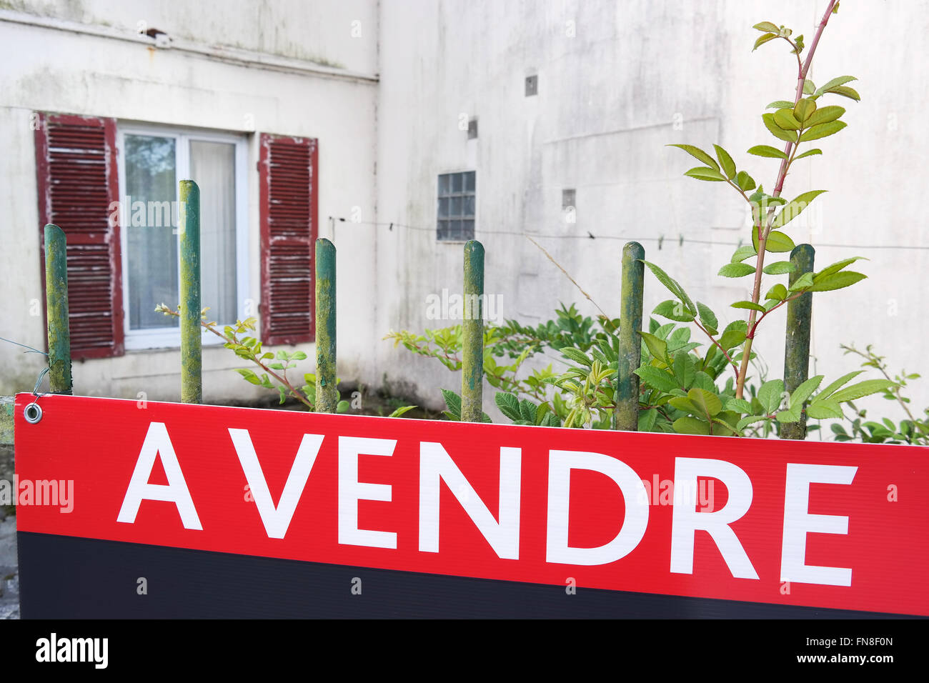 A Vendre - House for sale sign at a fence of a french home in Brittany ...