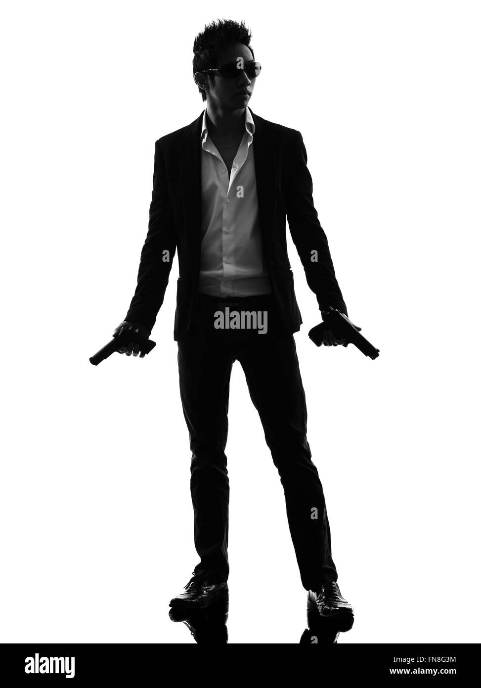 one asian gunman killer standing in silhouette isolated white ...