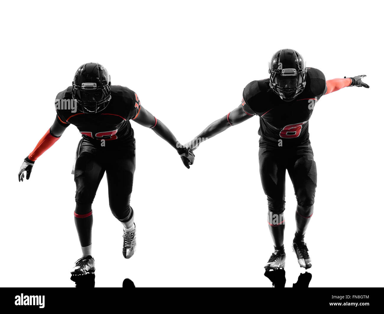 two american football players running in silhouette shadow on white ...