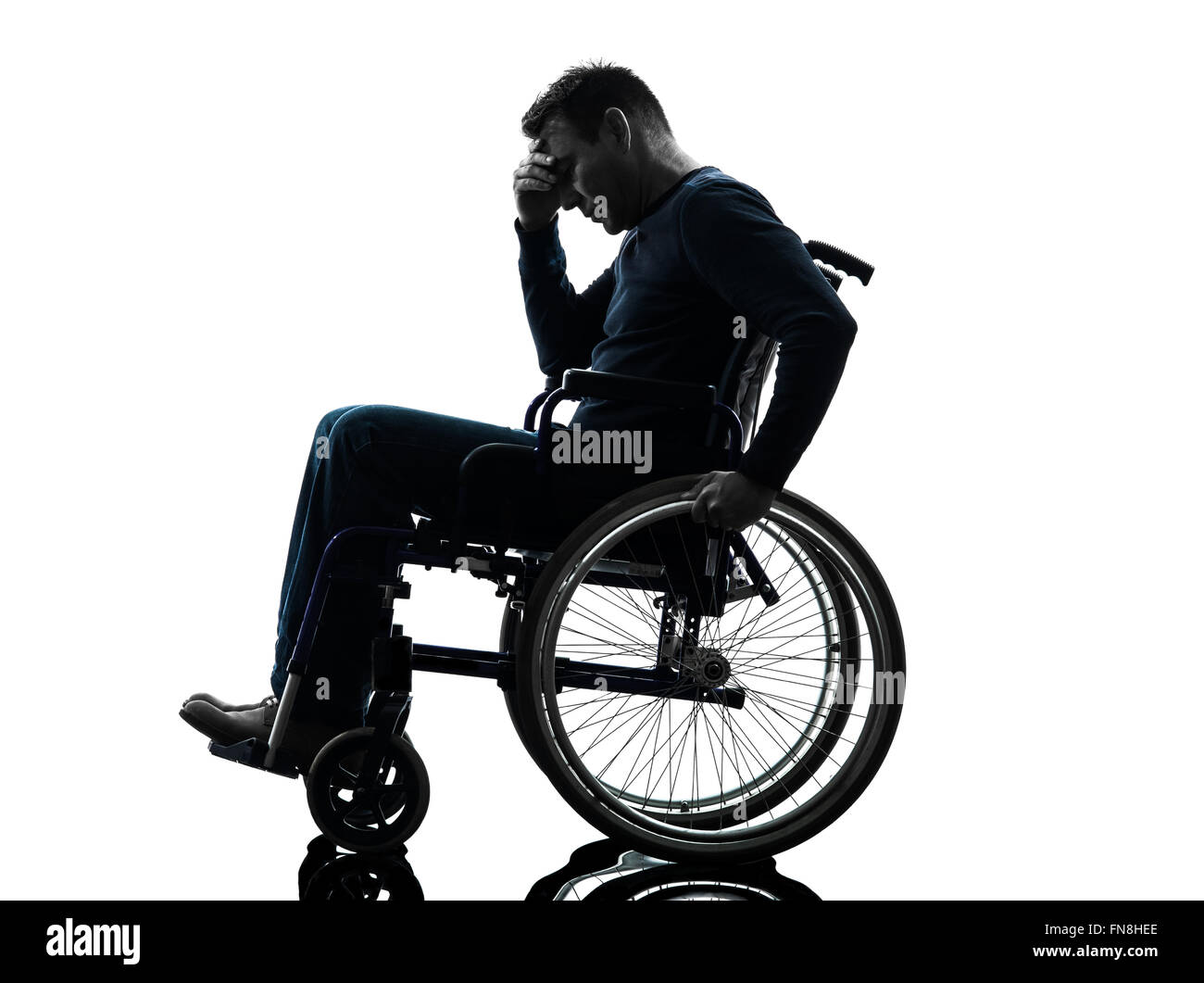 one handicapped man head in hands in silhouette studio on white ...