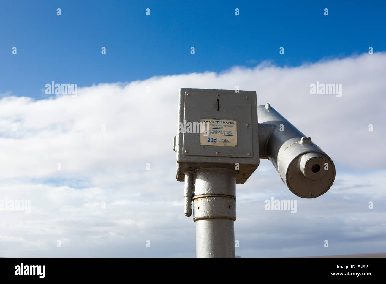 Seaside telescope and blue sky Stock Photo - Alamy