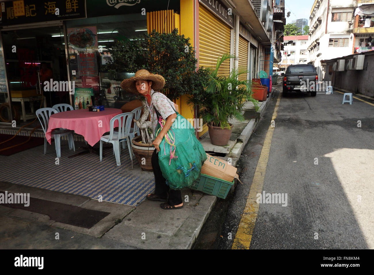 Old woman collecting rubbish, Kuala Lumpur, Malaysia Stock Photo - Alamy