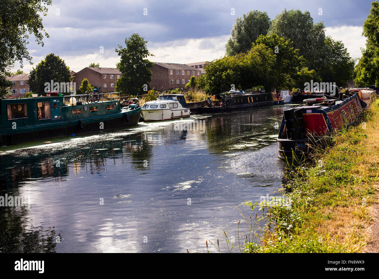 A group of boats rest along a canal Stock Photo - Alamy