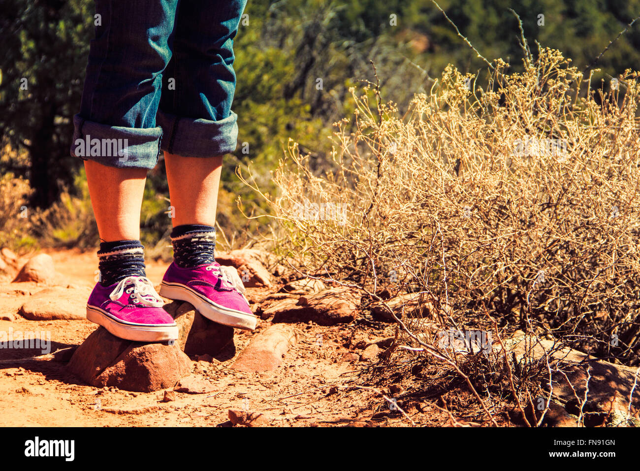 Woman's legs standing on rocks in desert, Arizona, United States Stock ...