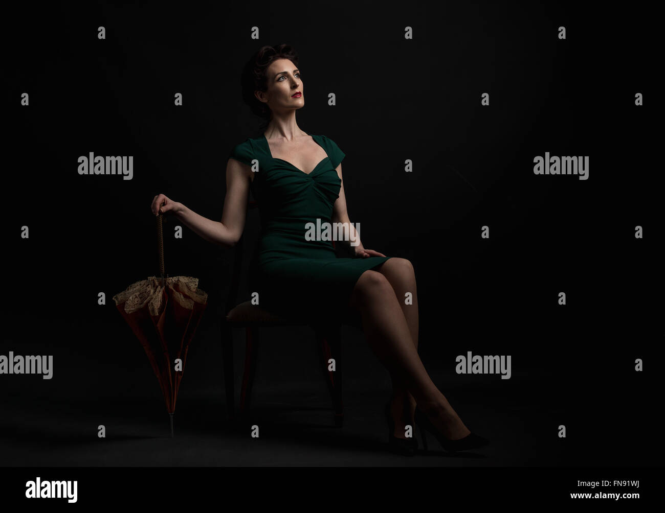 Woman sitting on green hi-res stock photography and images - Alamy