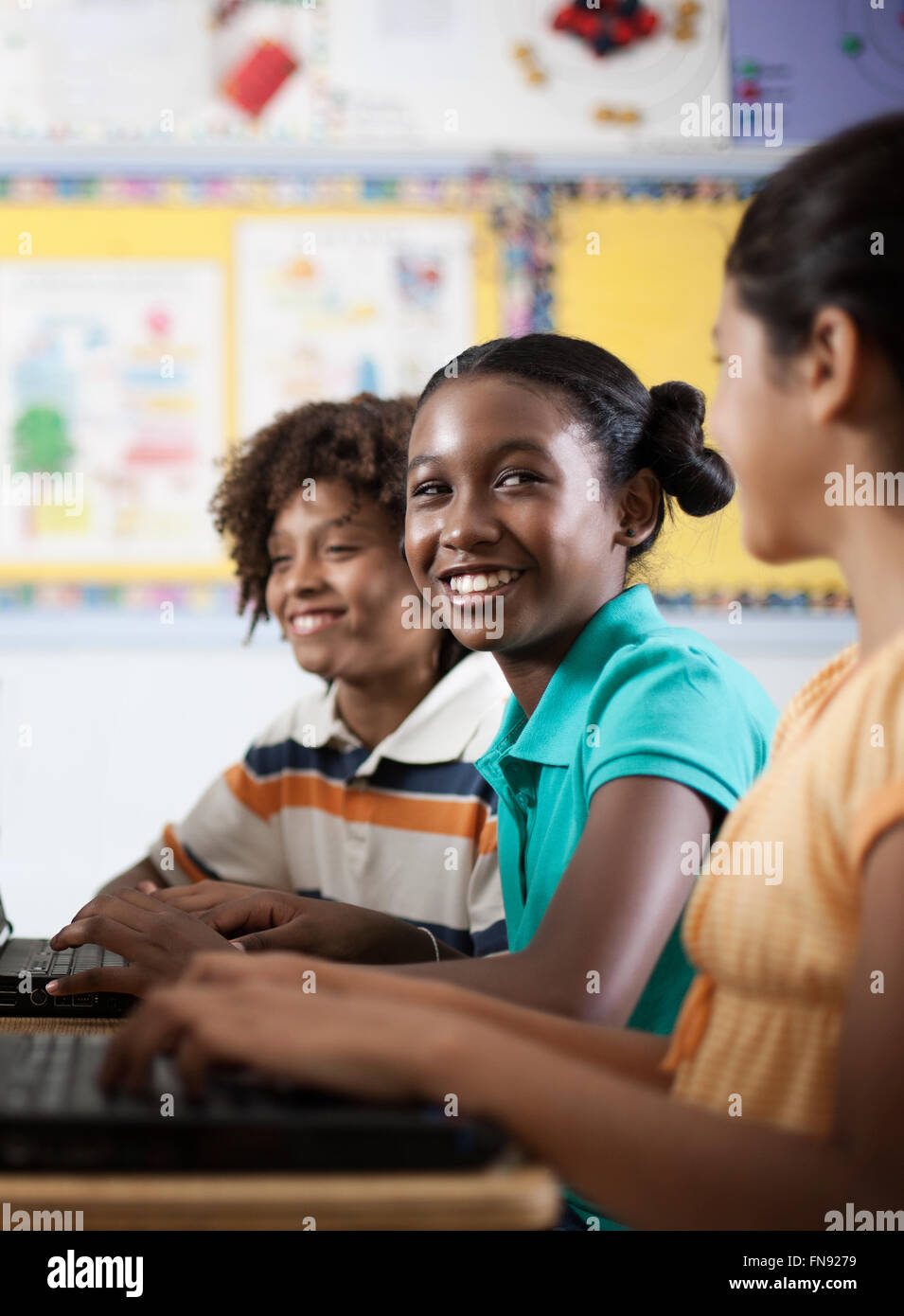 Three students sitting in class, a girl and two boys Stock Photo - Alamy
