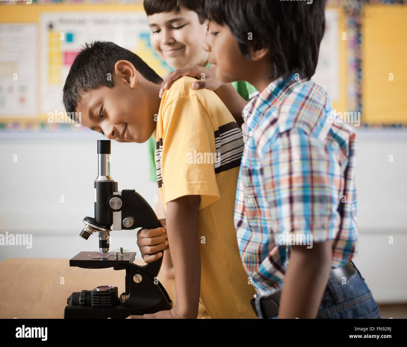 Two children using a microscope Stock Photo - Alamy