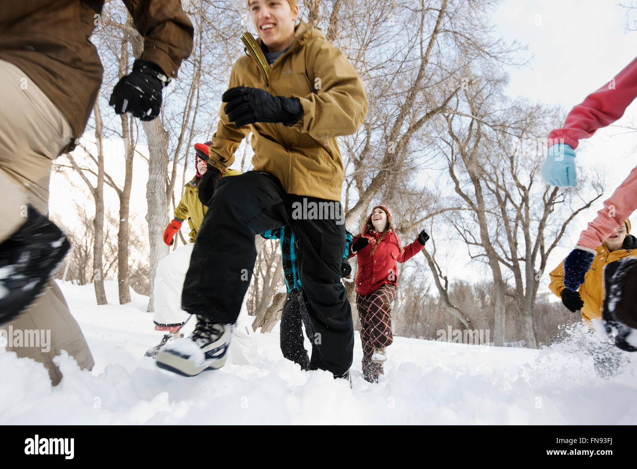 Children running across the snow Stock Photo - Alamy