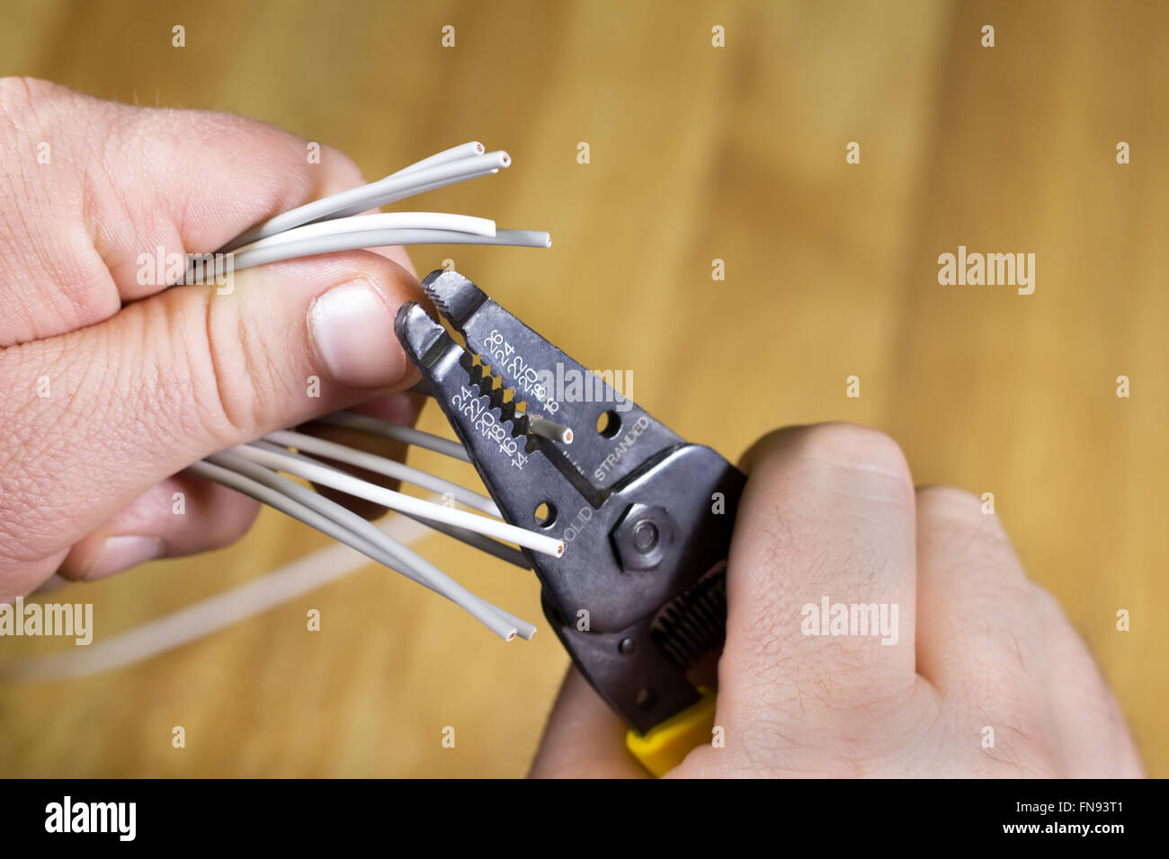 Close up of man's hands stripping insulated copper wires Stock Photo ...