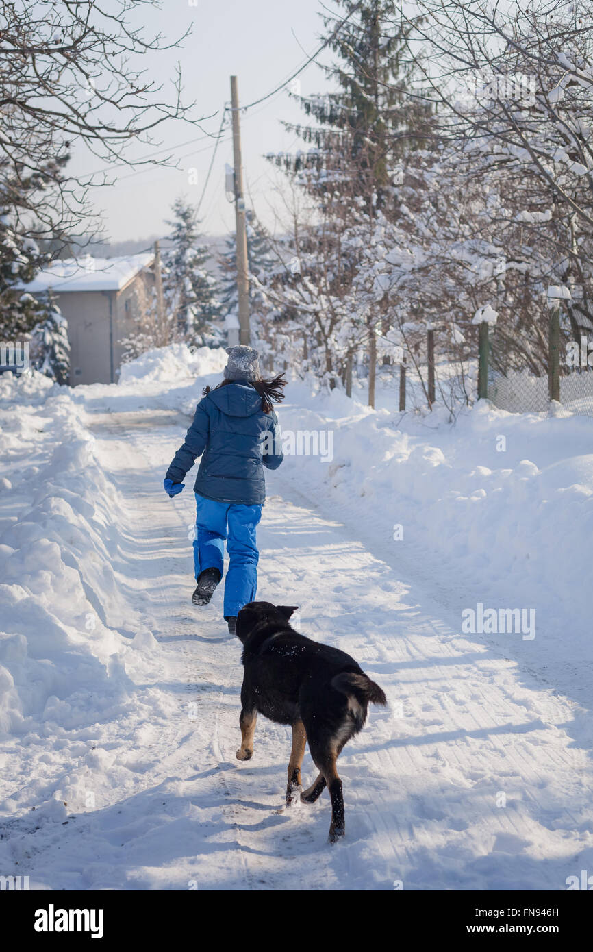 Child chasing dog hi-res stock photography and images - Alamy