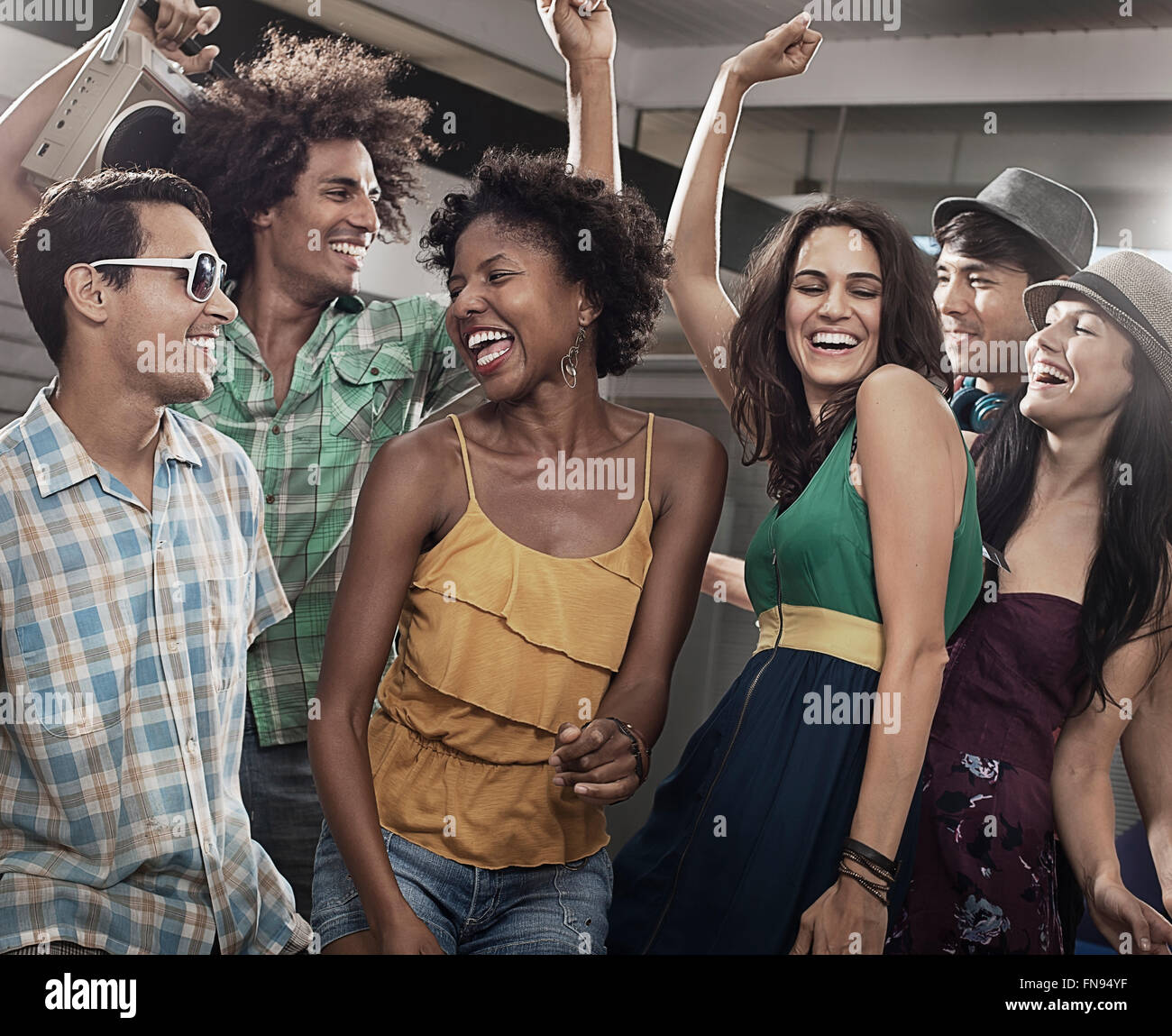 A group of friends, men and women hanging out together, partying Stock ...