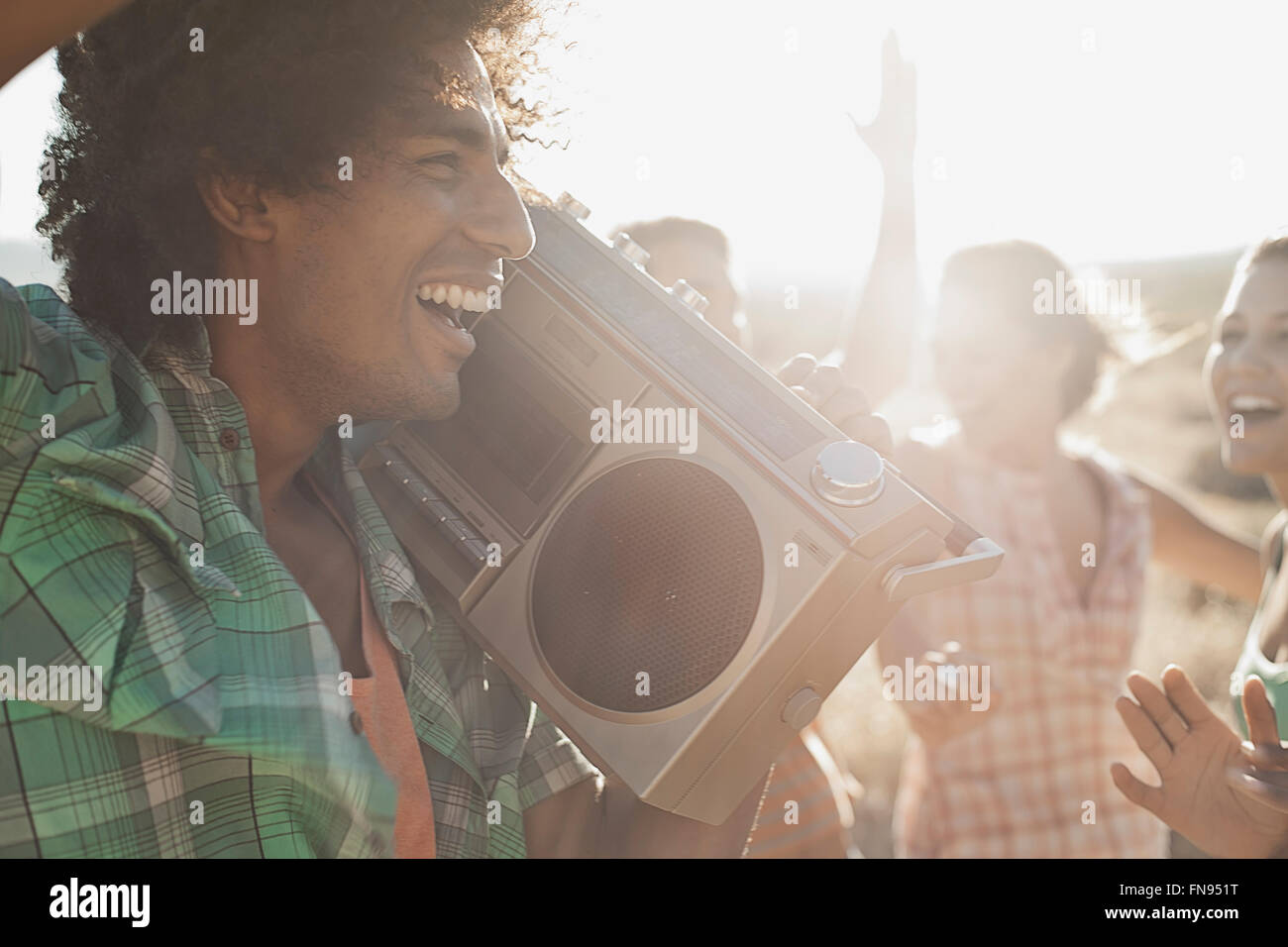 Group of young people, men and women walking on the open road with a ...