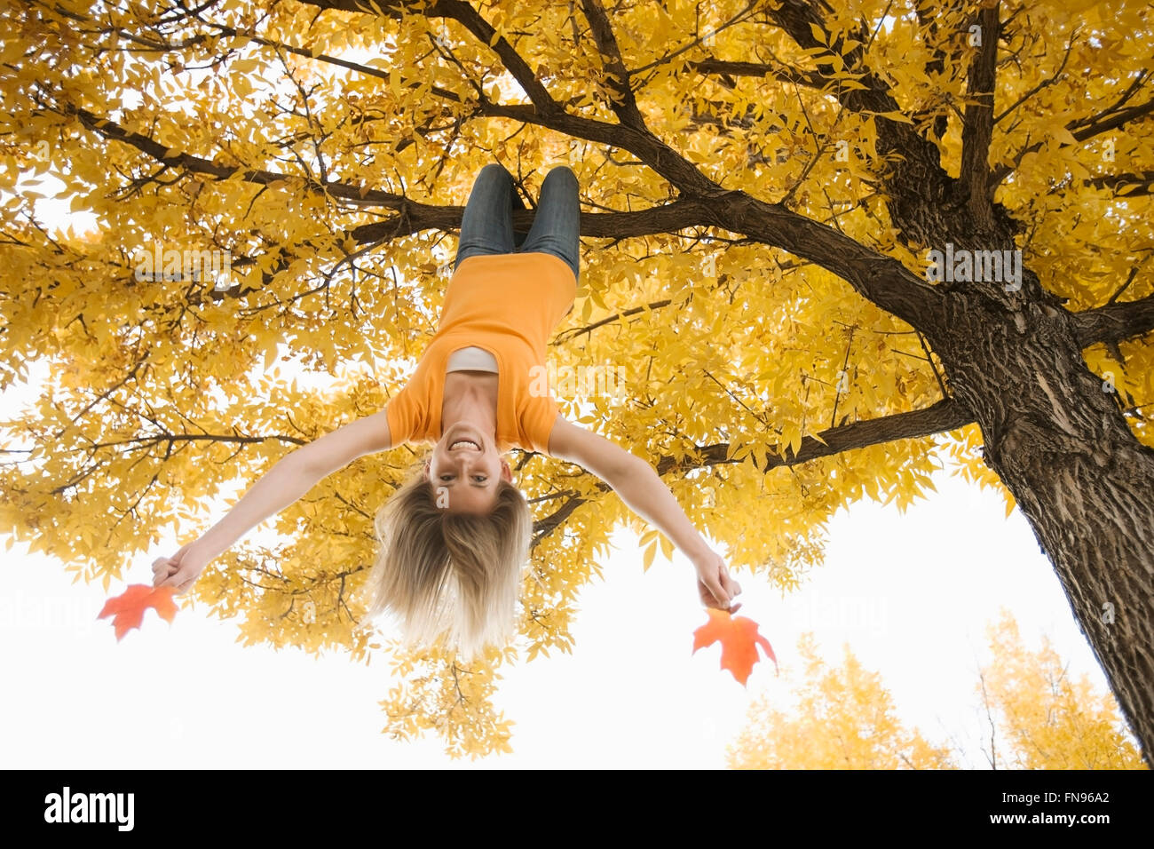 Girl hanging upside down from hi-res stock photography and images - Alamy