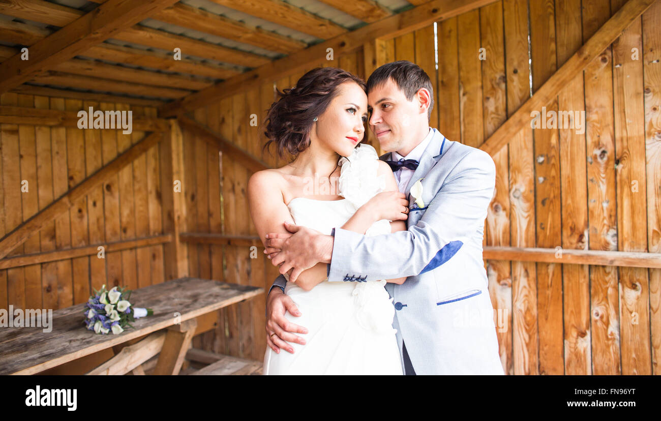 wedding pair hugging and kissing Stock Photo - Alamy