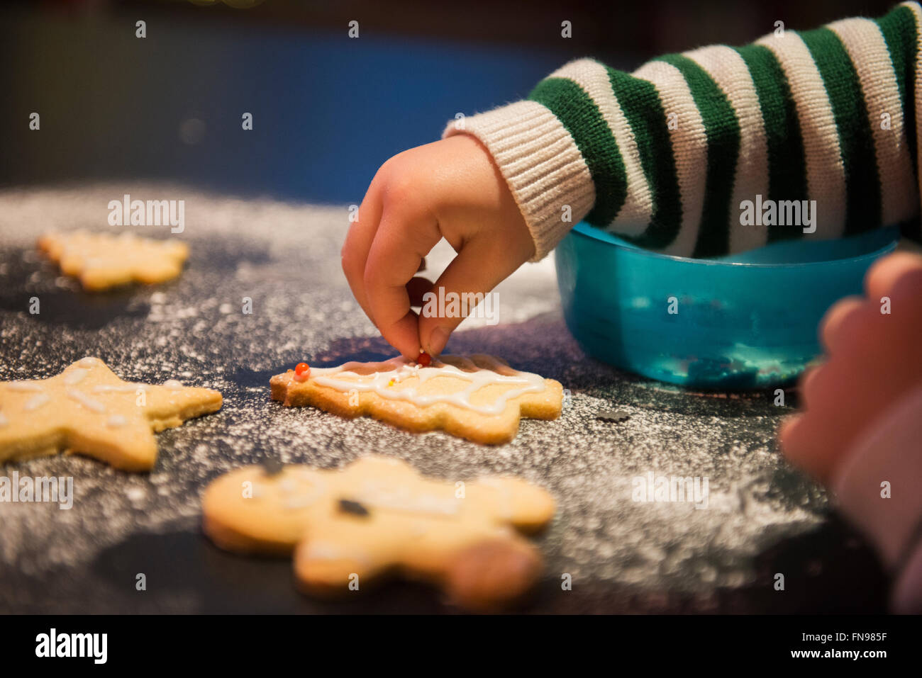 A child decorated Christmas biscuits Stock Photo - Alamy