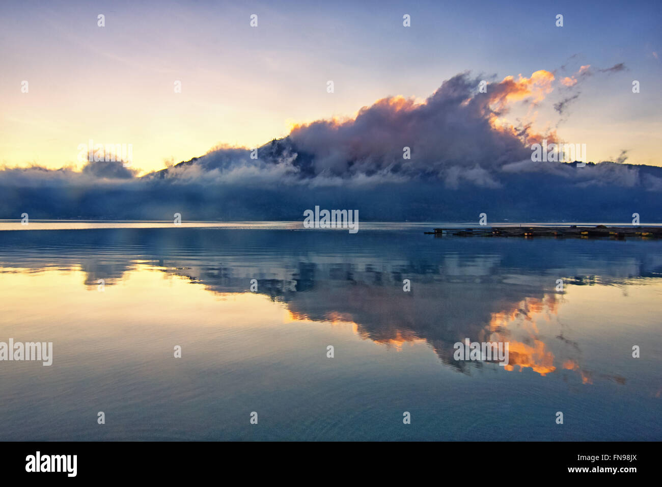 Clouds reflected in lake, Tembuku, Bali, Indonesia Stock Photo - Alamy