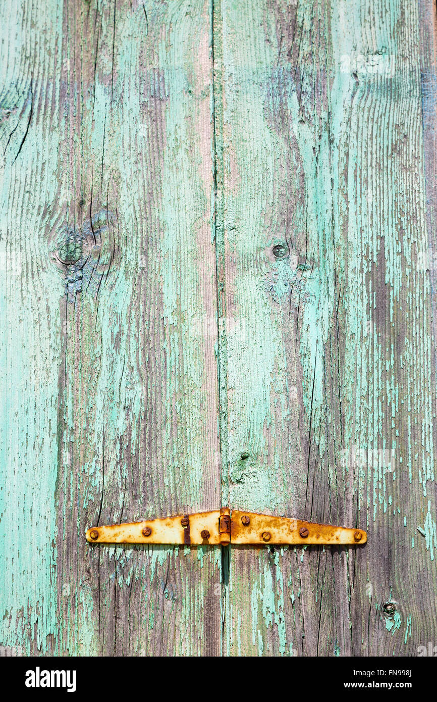 in the old wall a hinged window green wood and rusty metal Stock Photo ...