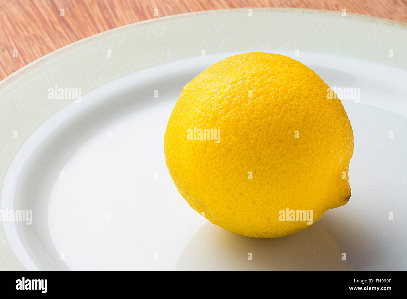 lemon on a plate Stock Photo - Alamy