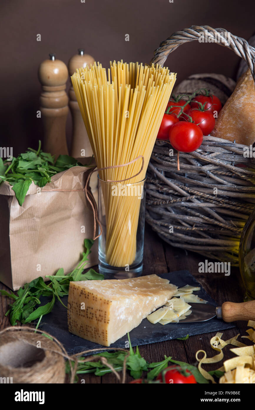 Pasta, parmesan, rocket and tomatoes Stock Photo - Alamy