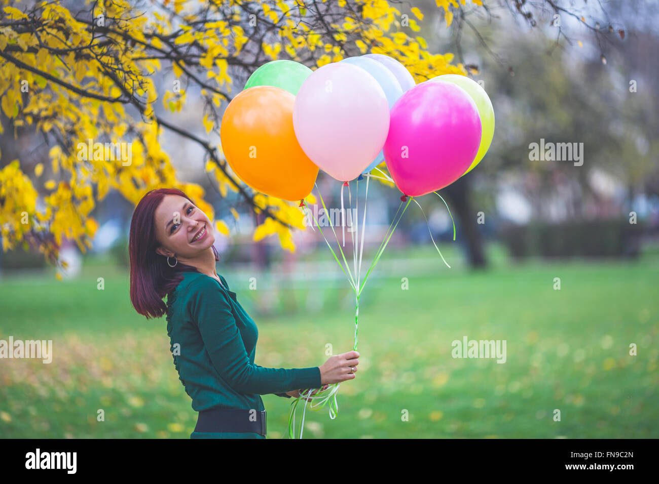 Woman with balloons hi-res stock photography and images - Alamy