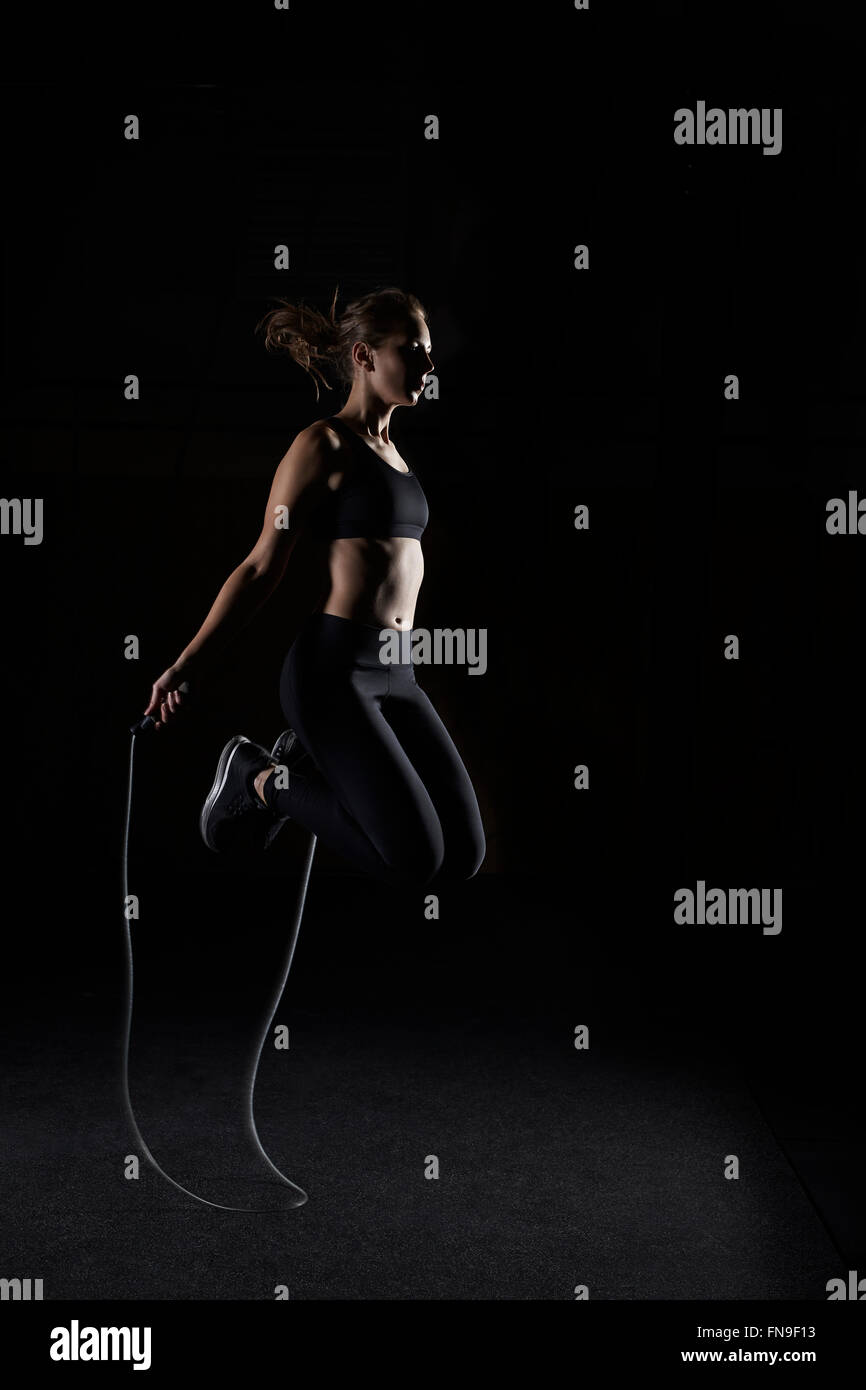 Woman skipping in gym Stock Photo - Alamy