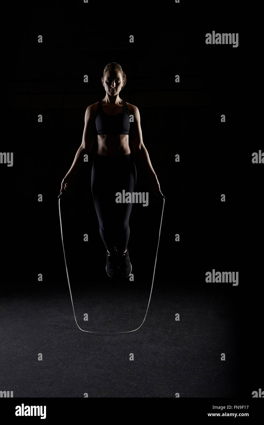 Woman skipping in gym Stock Photo - Alamy