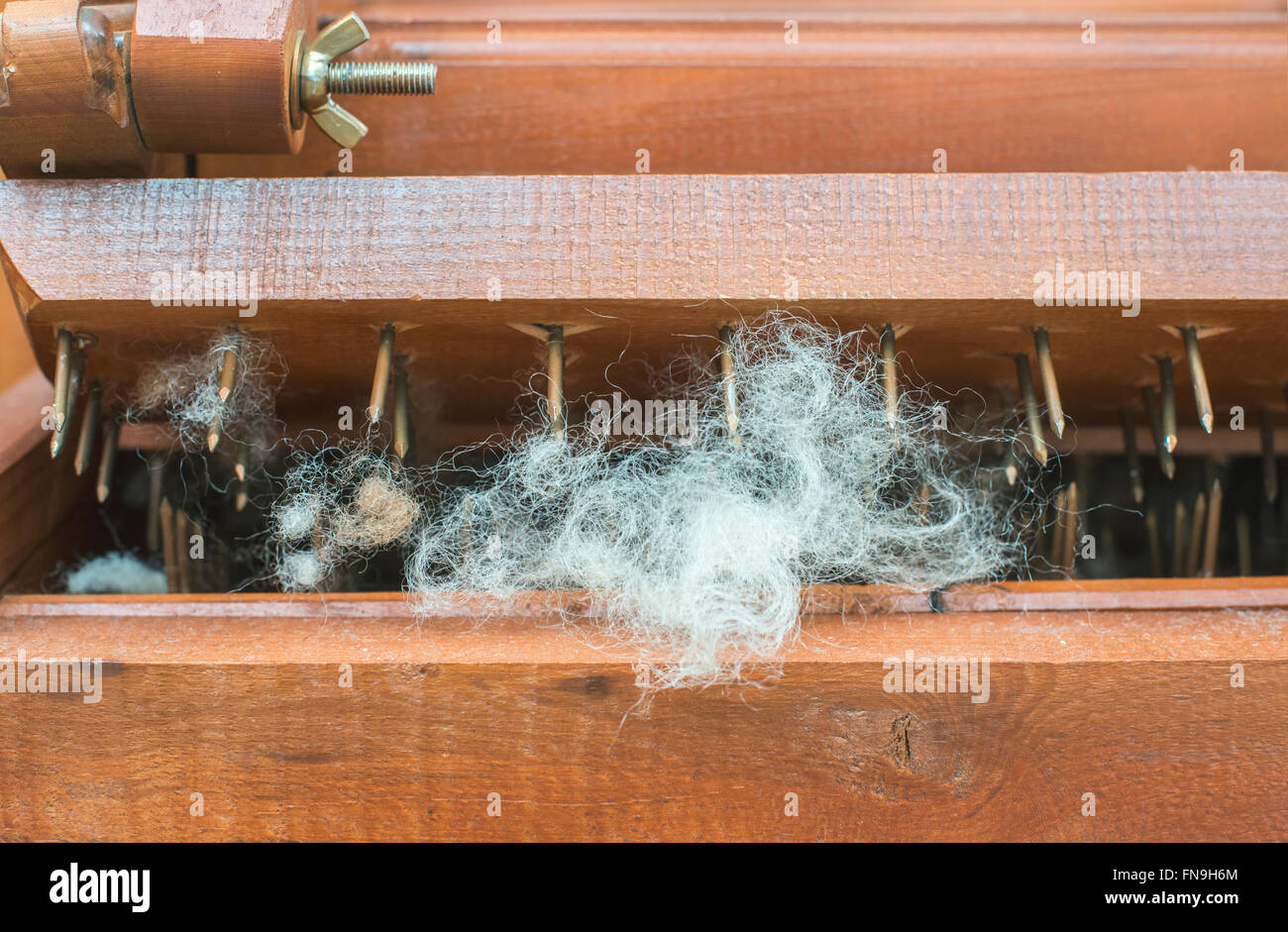 Manual processing of wool Stock Photo - Alamy