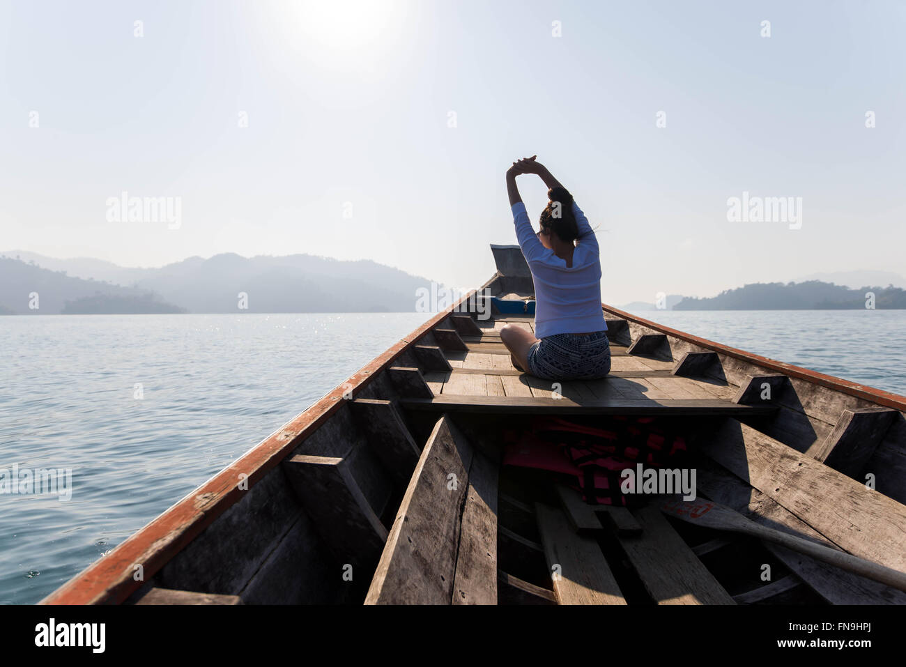 Woman on boat Stock Photo - Alamy
