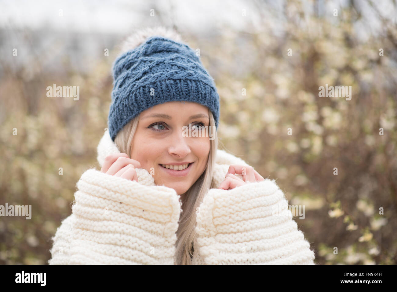 Smiling woman wearing warm hi-res stock photography and images - Alamy
