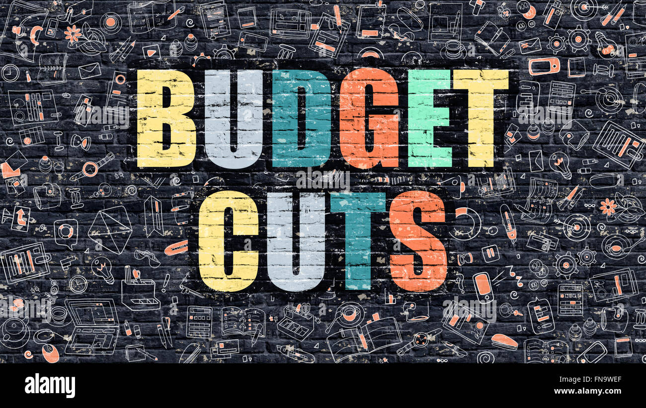 Budget Cuts Concept. Multicolor on Dark Brickwall Stock Photo - Alamy