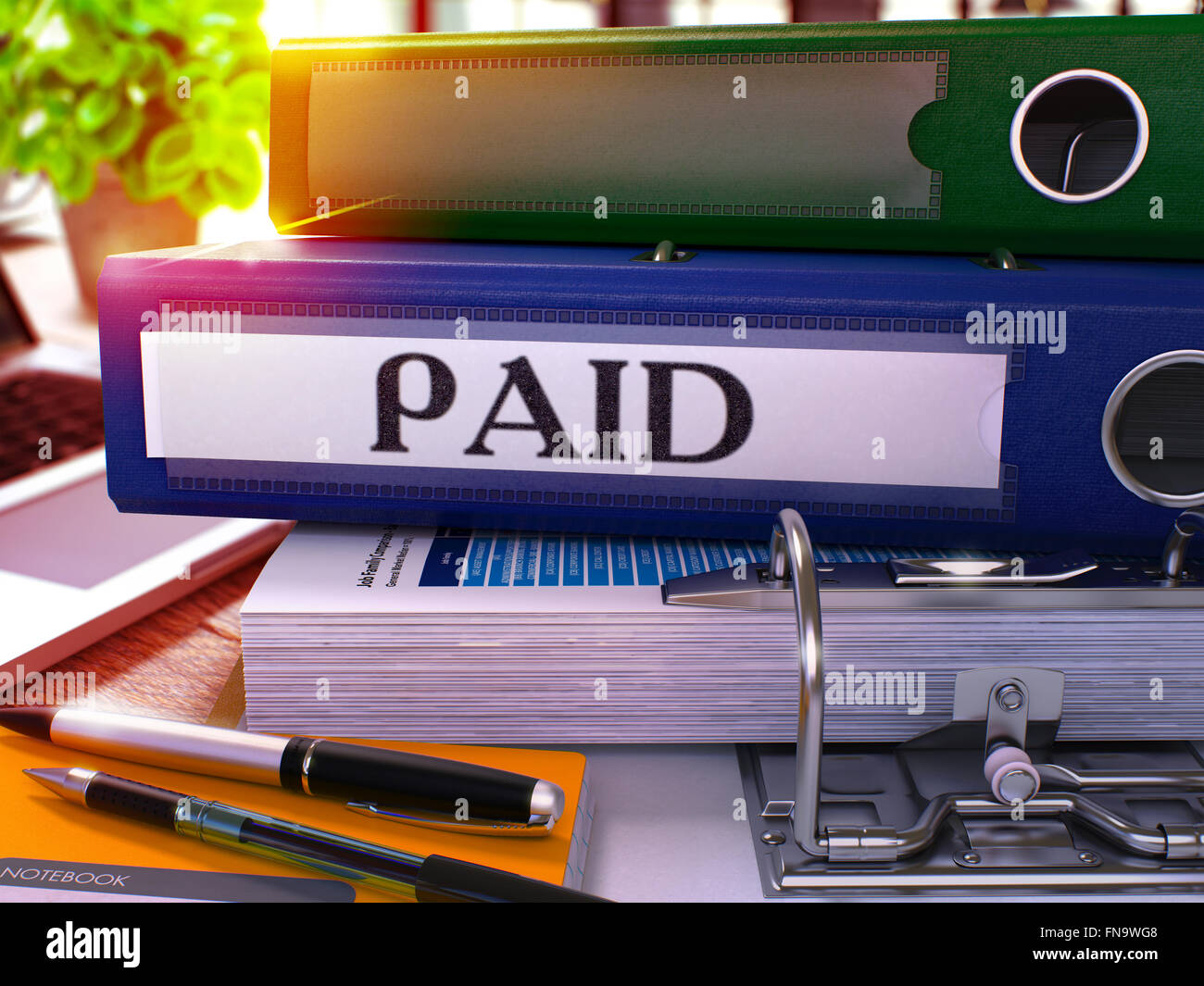 Blue Office Folder with Inscription Paid Stock Photo - Alamy