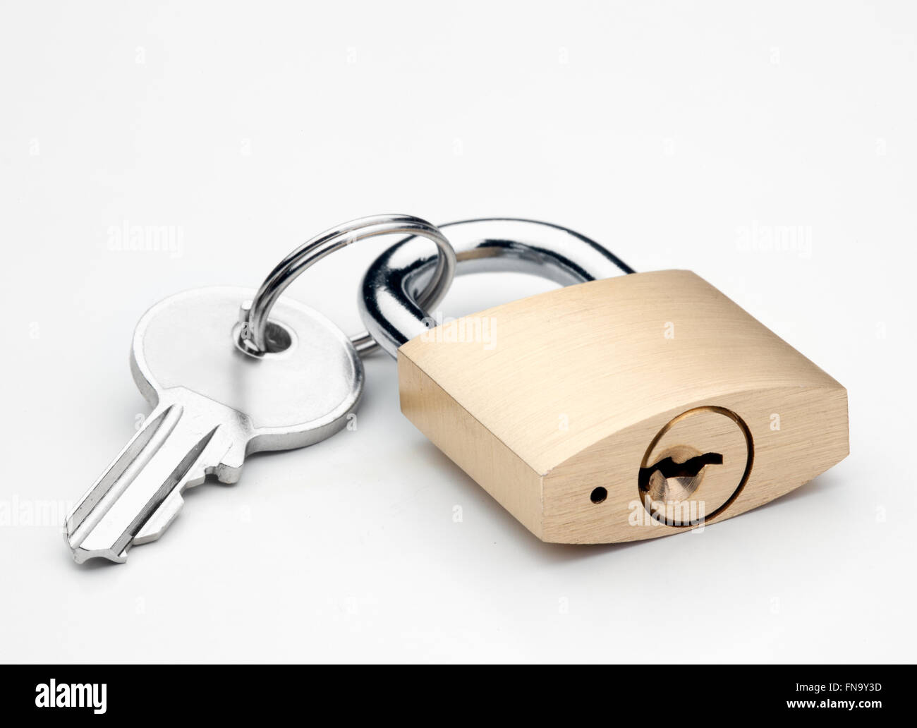Lock and key on white background Stock Photo - Alamy