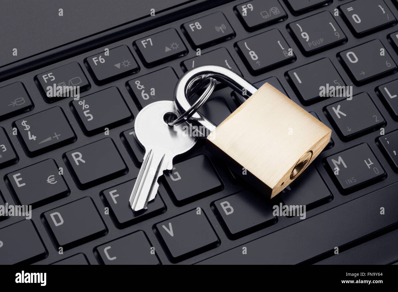 Computer security or safety concept. Laptop keyboard with lock and ...