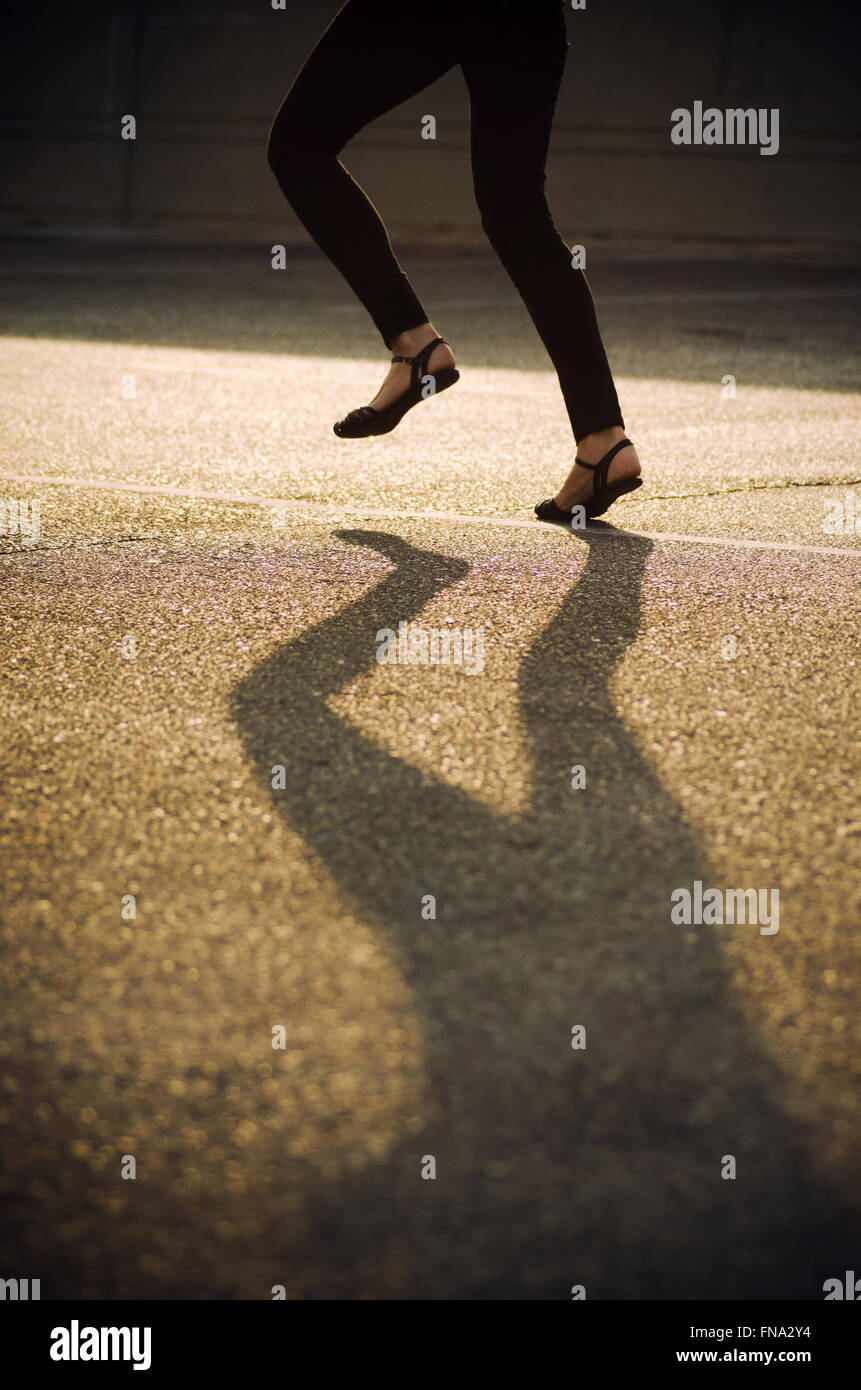 Shadow of woman running hi-res stock photography and images - Alamy
