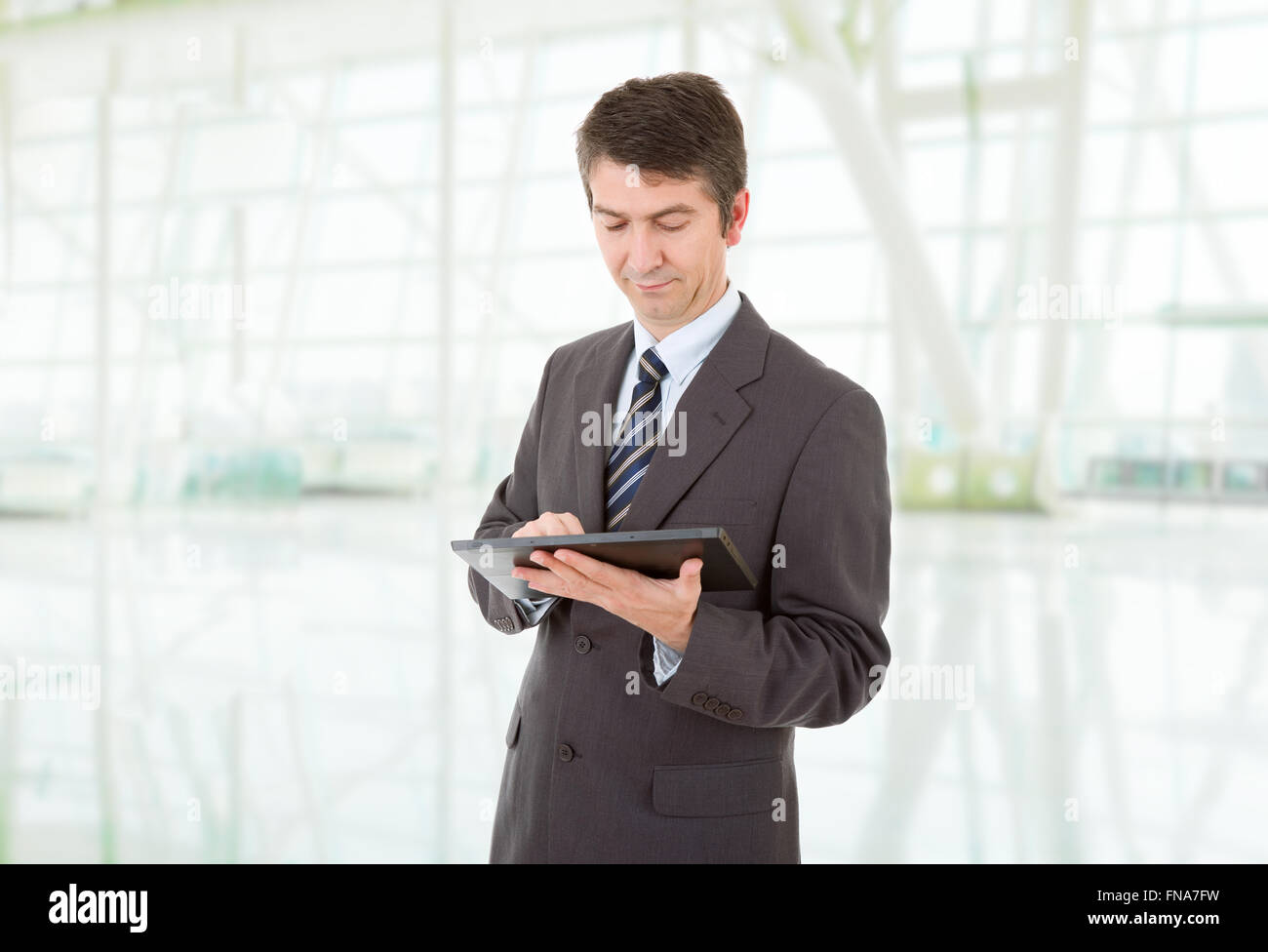businessman using touch pad of tablet pc, at the office Stock Photo - Alamy