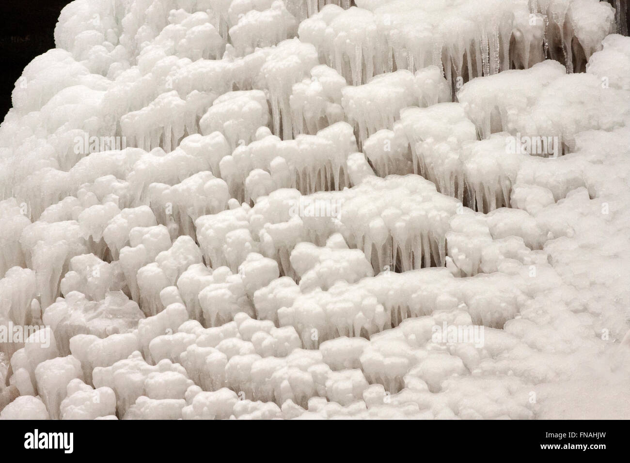 Frozen Waterfall popcorn shaped ice formed from water sprayed down from ...