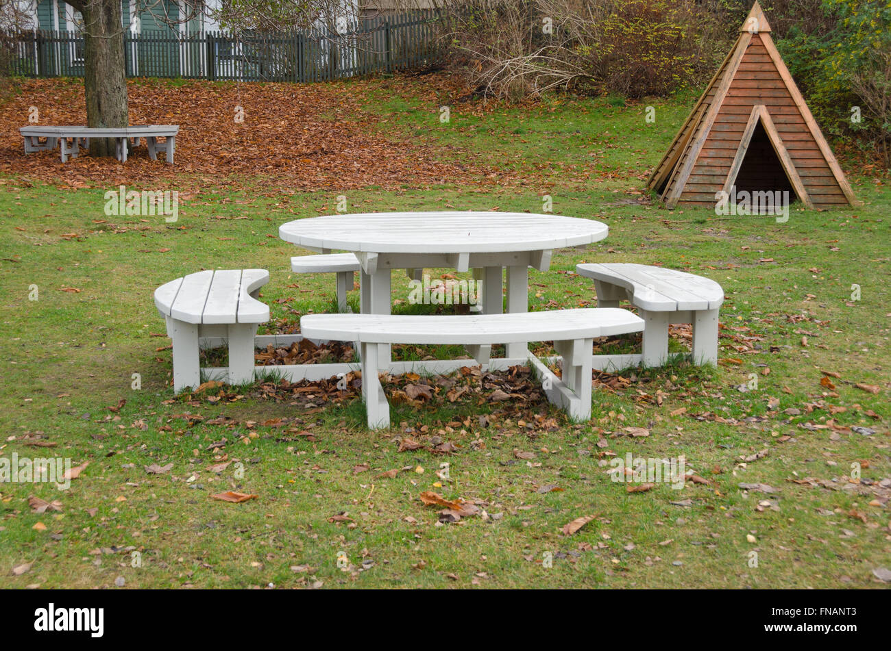 one park bench with a table in the mittle where you can eat Stock Photo ...