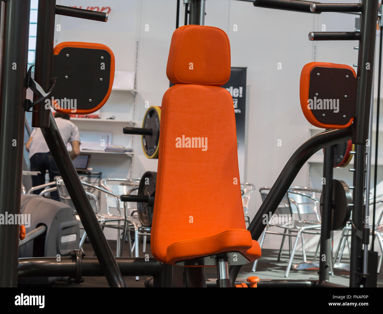 Orange Pectoral Machine for Fitness Exercise Stock Photo - Alamy