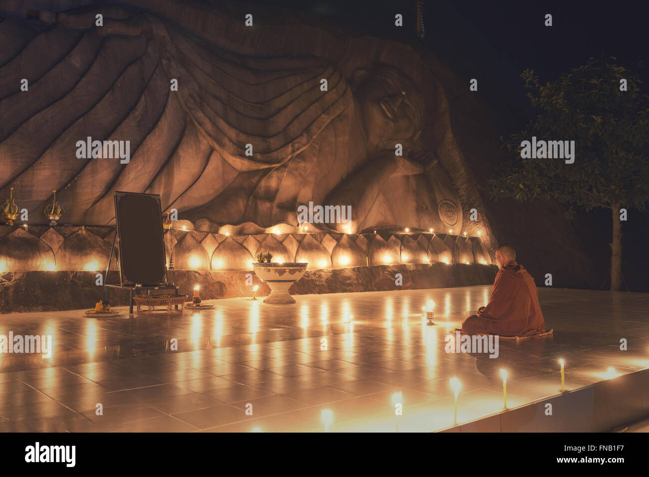 Asian monk meditating in a Buddhist temple Stock Photo - Alamy