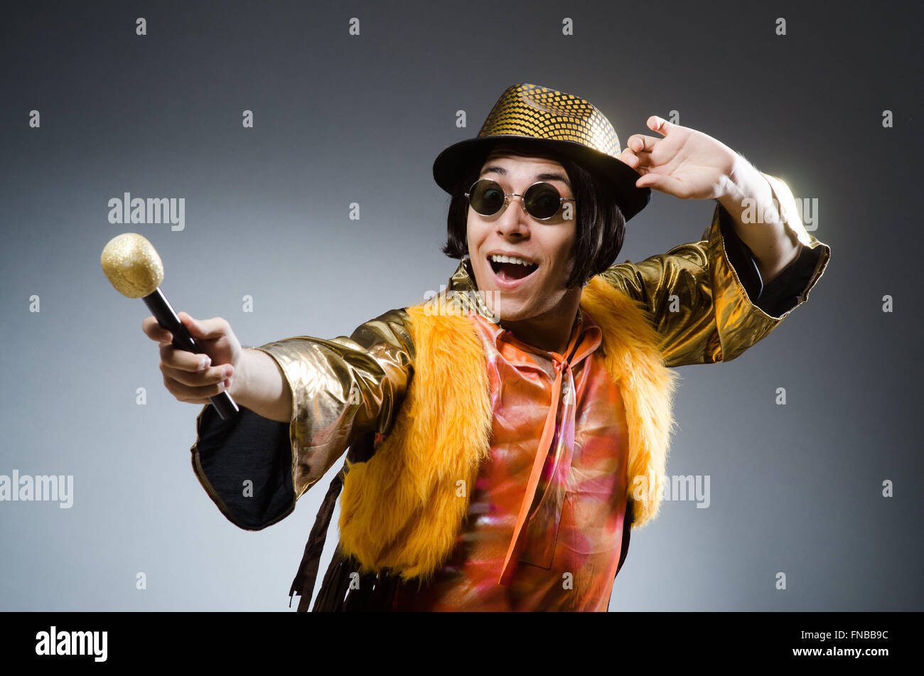 Young man singing in karaoke club Stock Photo - Alamy