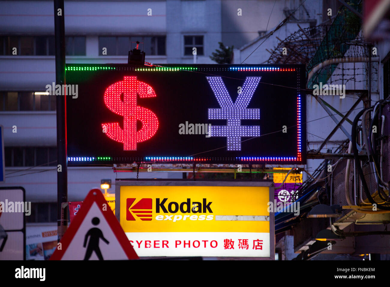 Dollar Yen illuminated symbols neon sign. Kodak sign red and blue money ... Dollar Yen illuminated symbols neon sign. Kodak sign red and blue money ...