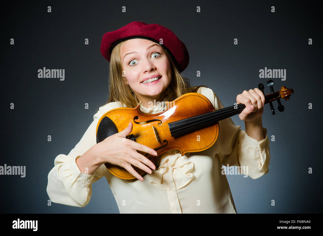 Woman violin player in musical concept Stock Photo - Alamy