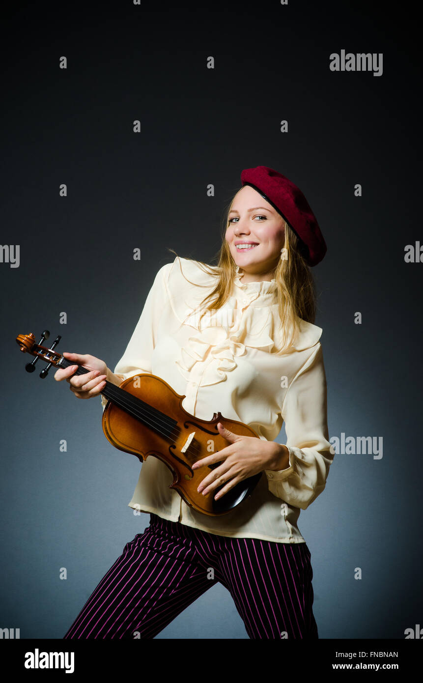 Woman violin player in musical concept Stock Photo - Alamy