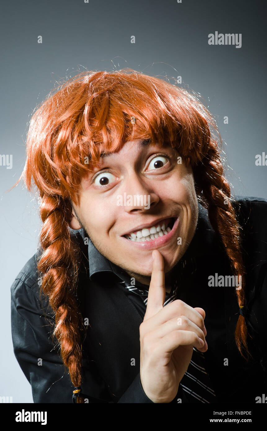 Funny man with red hair wig Stock Photo - Alamy