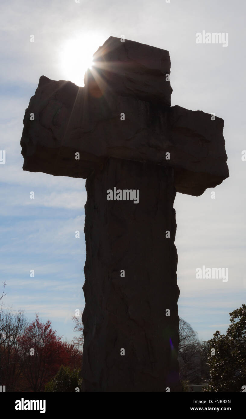 stone cross monument with sun flare Stock Photo - Alamy