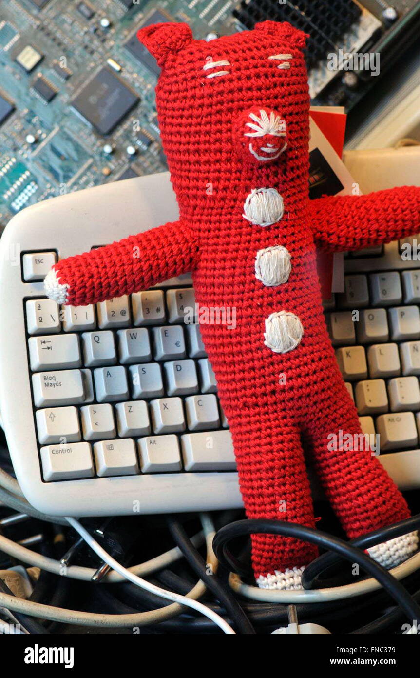 Computer and doll Stock Photo - Alamy