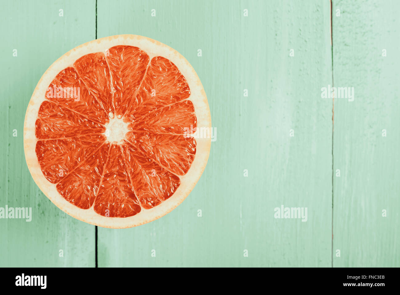 Retro Effect Of Fresh Red Grapefruit Slice Stock Photo - Alamy