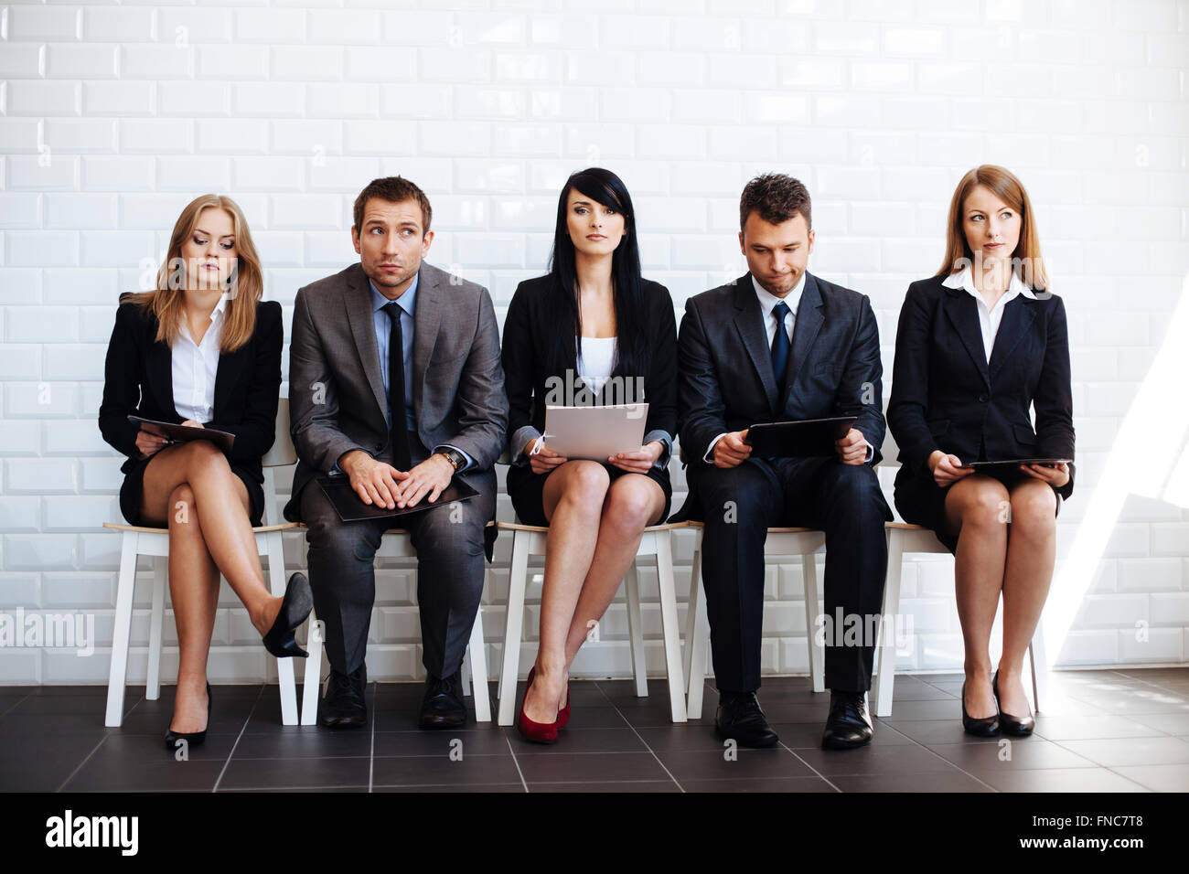 Dealing with job interview. Group of business people waiting for ...